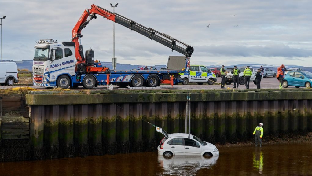 Man rescued from water after car plunges into harbour | STV News