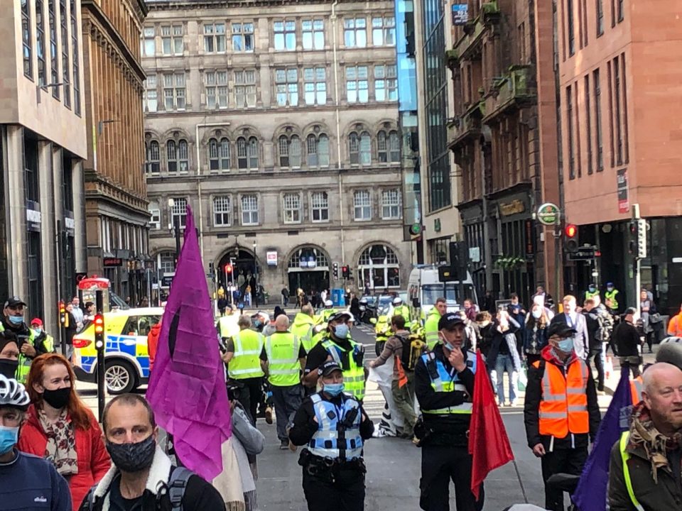 In pictures: Protesters target JP Morgan building as COP26 continues ...