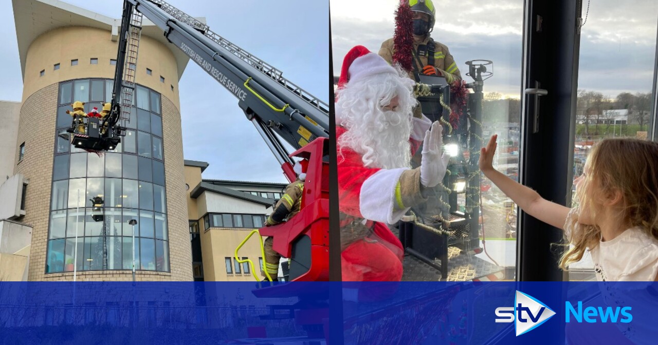 Flying visit: Santa uses cherry picker to greet kids at hospital window ...