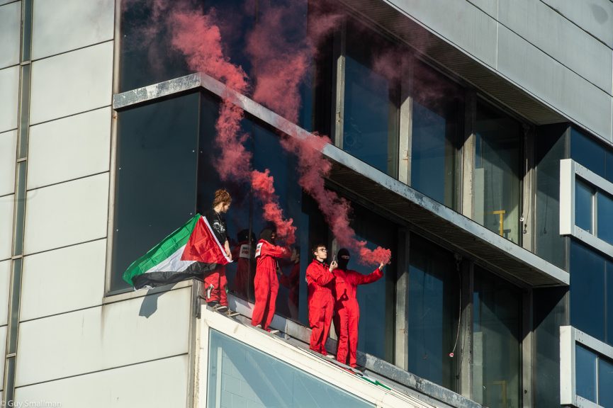 Workers forced to evacuate as activists protest on roof of Thales arms ...