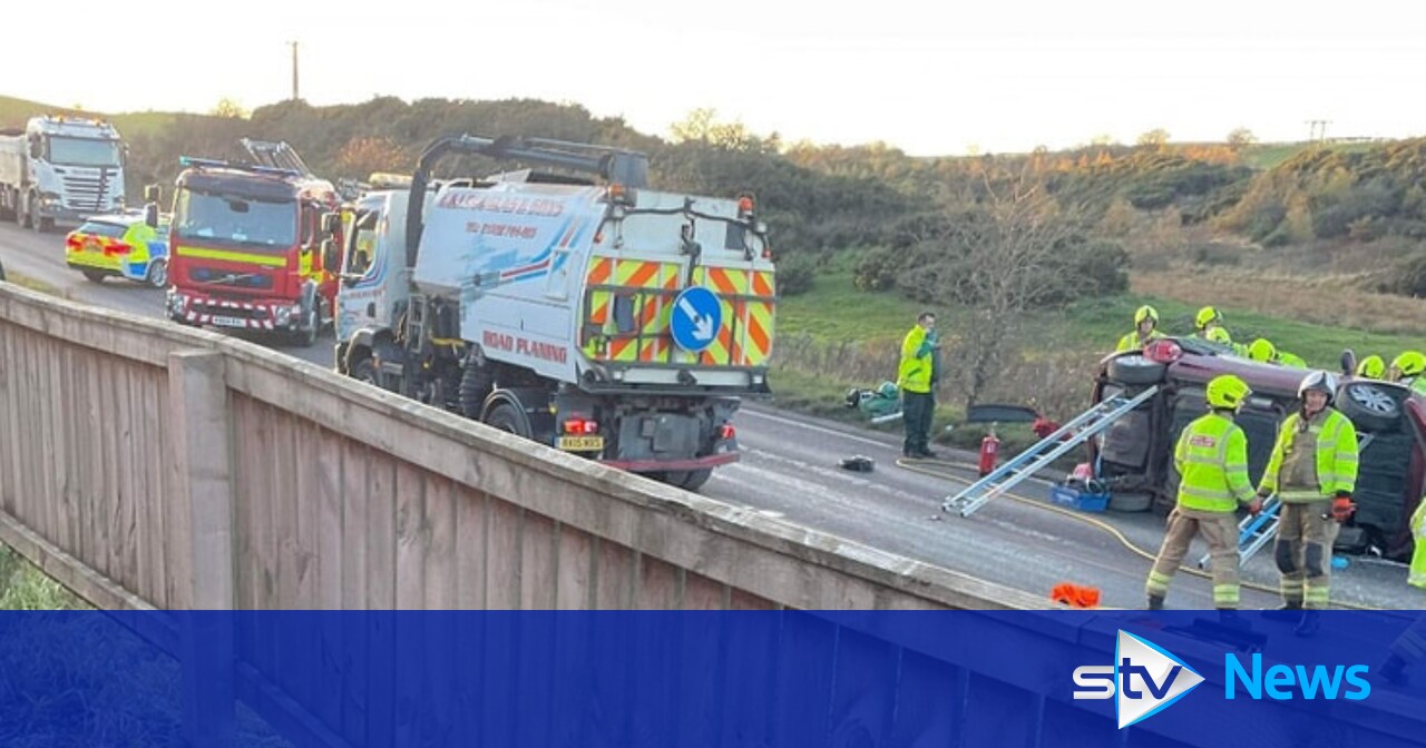 Two in hospital as car crashes into 'sweeper lorry' and lands on side ...