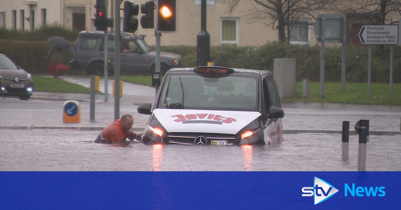 Cars float off and people stranded in homes by flooding in Scotland as ...