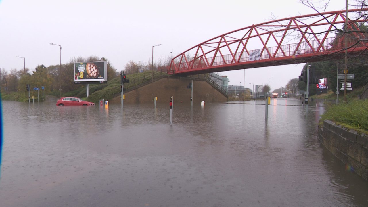 Cars float off and people stranded in homes by flooding in Scotland as ...