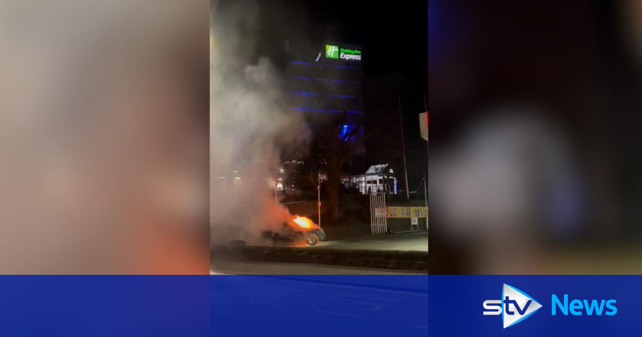 Fire crews battle blaze after car catches fire outside petrol station ...