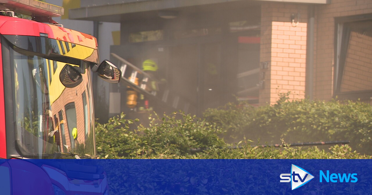 Two hospitalised after fire tears through block of flats in Edinburgh ...