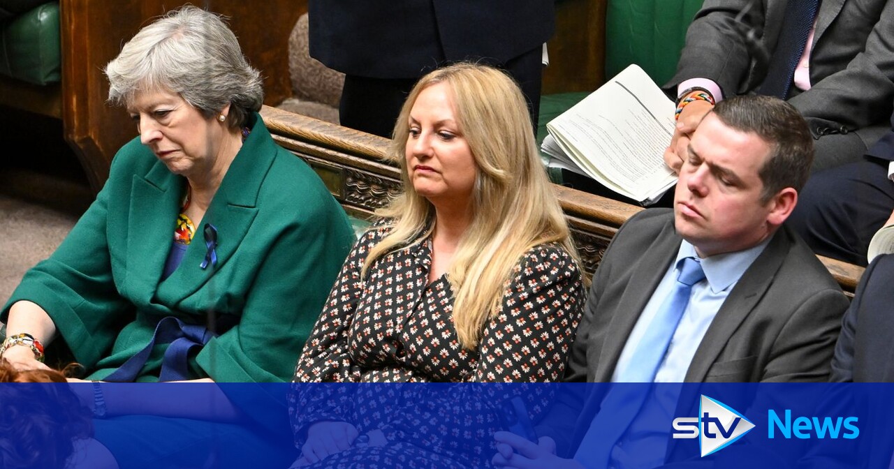 Ex-SNP MP Lisa Cameron crosses floor to Tory benches flanked by Theresa ...