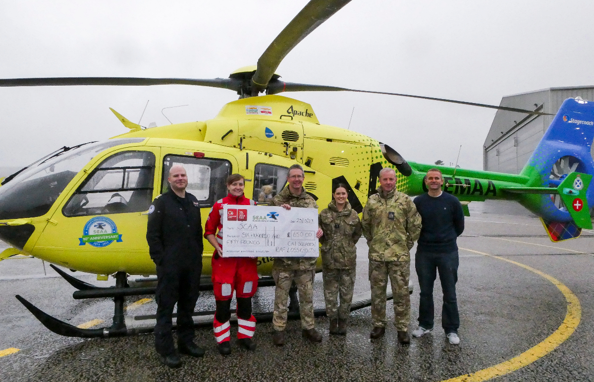 RAF officer presents fundraising cheque to Scottish Air Ambulance ...