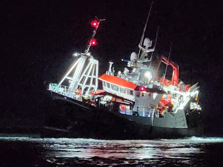 Rescue launched after trawler with seven aboard runs aground on rocks ...