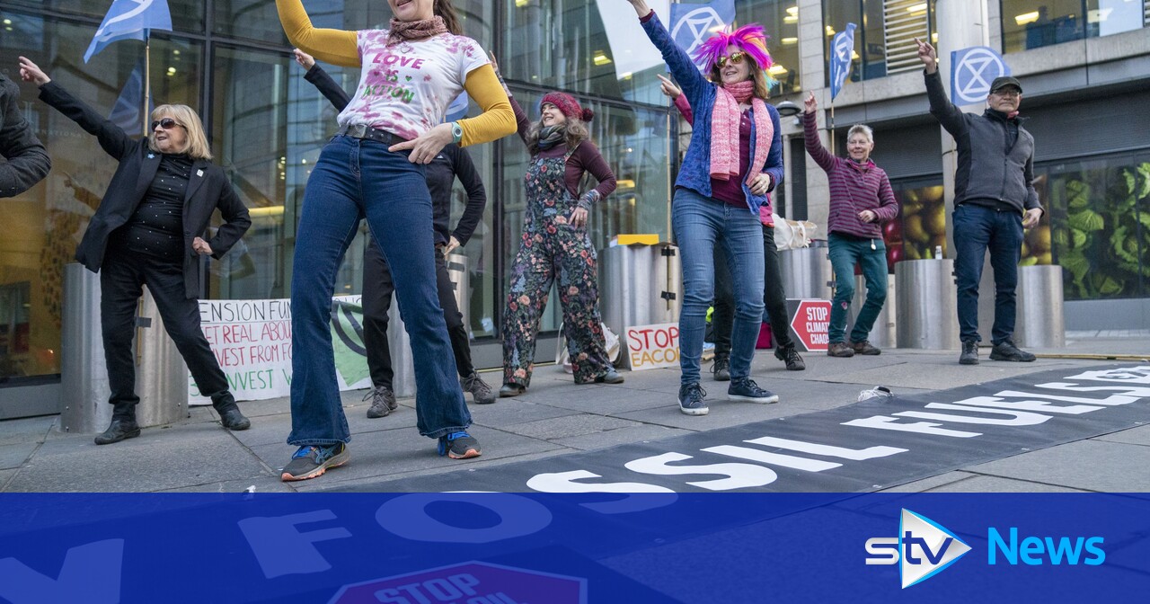 Climate activists stage 'Stayin' Alive' dance demonstration outside ...