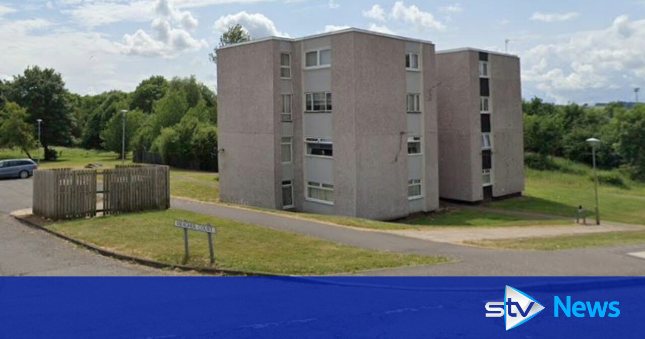 Woman taken to hospital after deliberate fire started outside flat in ...