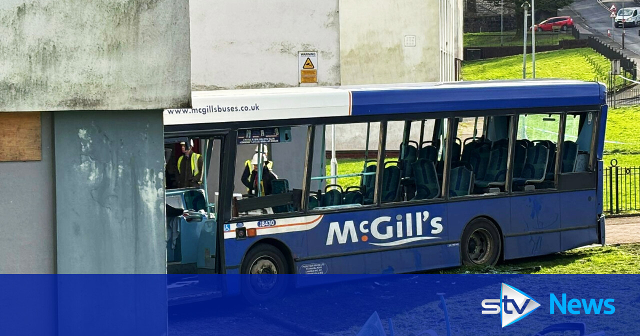 Five in hospital after bus crashes into high-rise block of flats in ...
