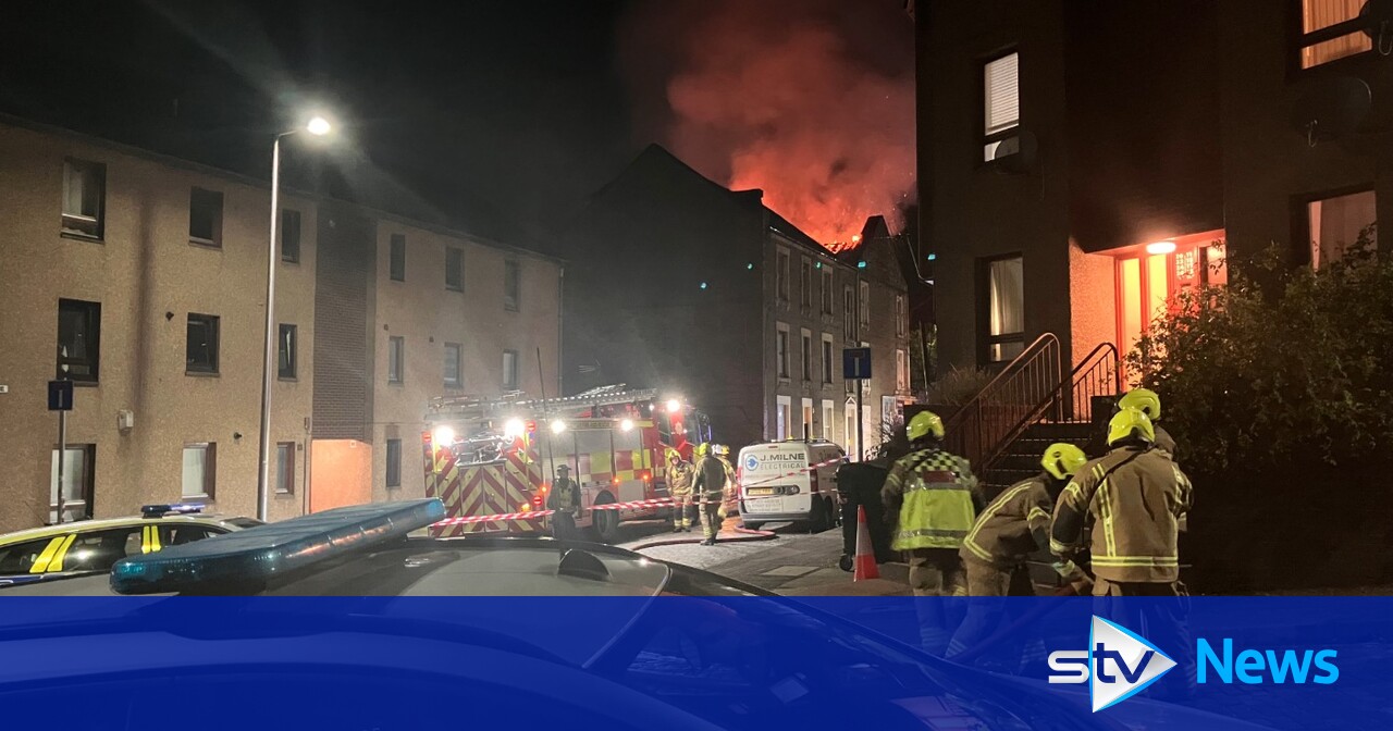 Firefighters tackle blaze at Dundee tenement block as flames shoot ...