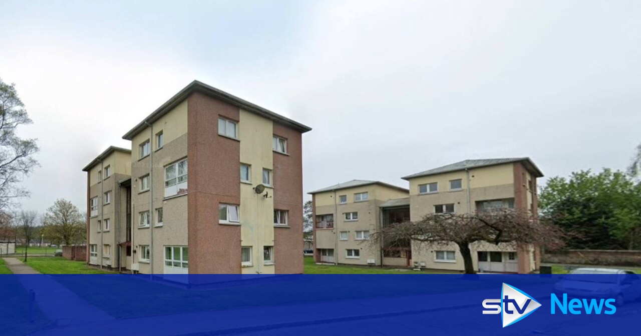 Woman taken to hospital after falling from window at block of flats in ...