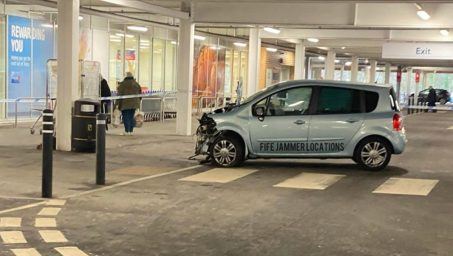 Man taken to hospital after car crashes into bollards outside Tesco in ...
