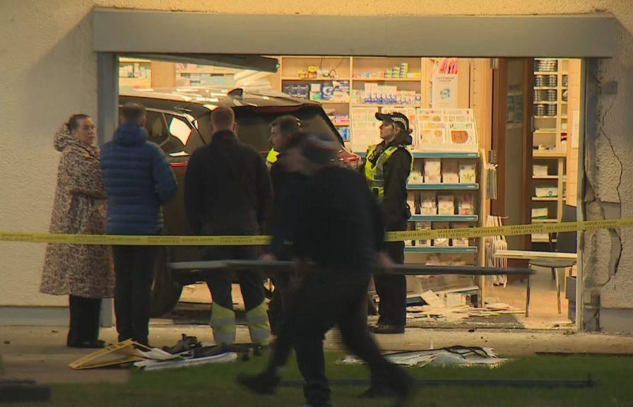 Woman in hospital after car crashes into pharmacy in Inverness | STV News