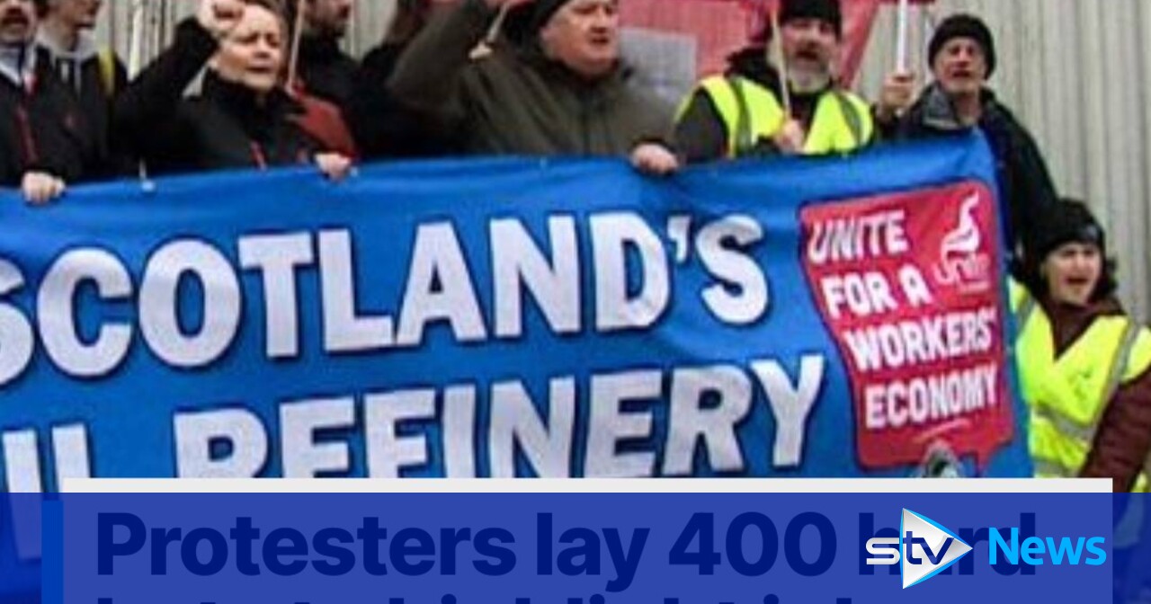 Protesters lay 400 hard hats to highlight job losses at oil refinery ...