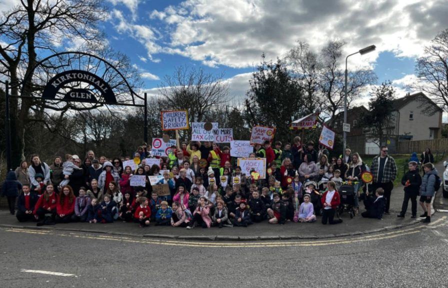 'Save our lollipop': Parents gather to protest cuts to crossing ...
