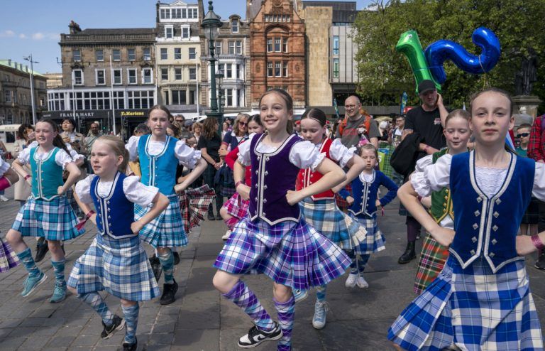 Hundreds march in colourful costumes for Edinburgh’s first Tartan ...