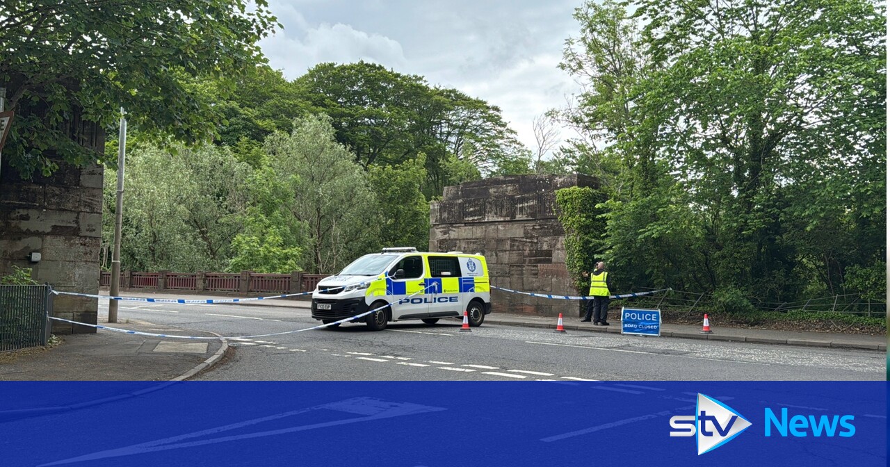 Road closed after body found as police launch unexplained death probe | STV News