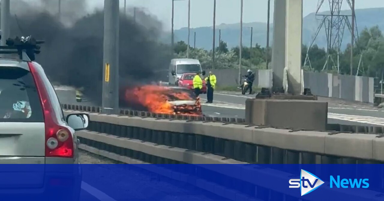 Section of M8 closed after vehicle catches fire as drivers warned of ...