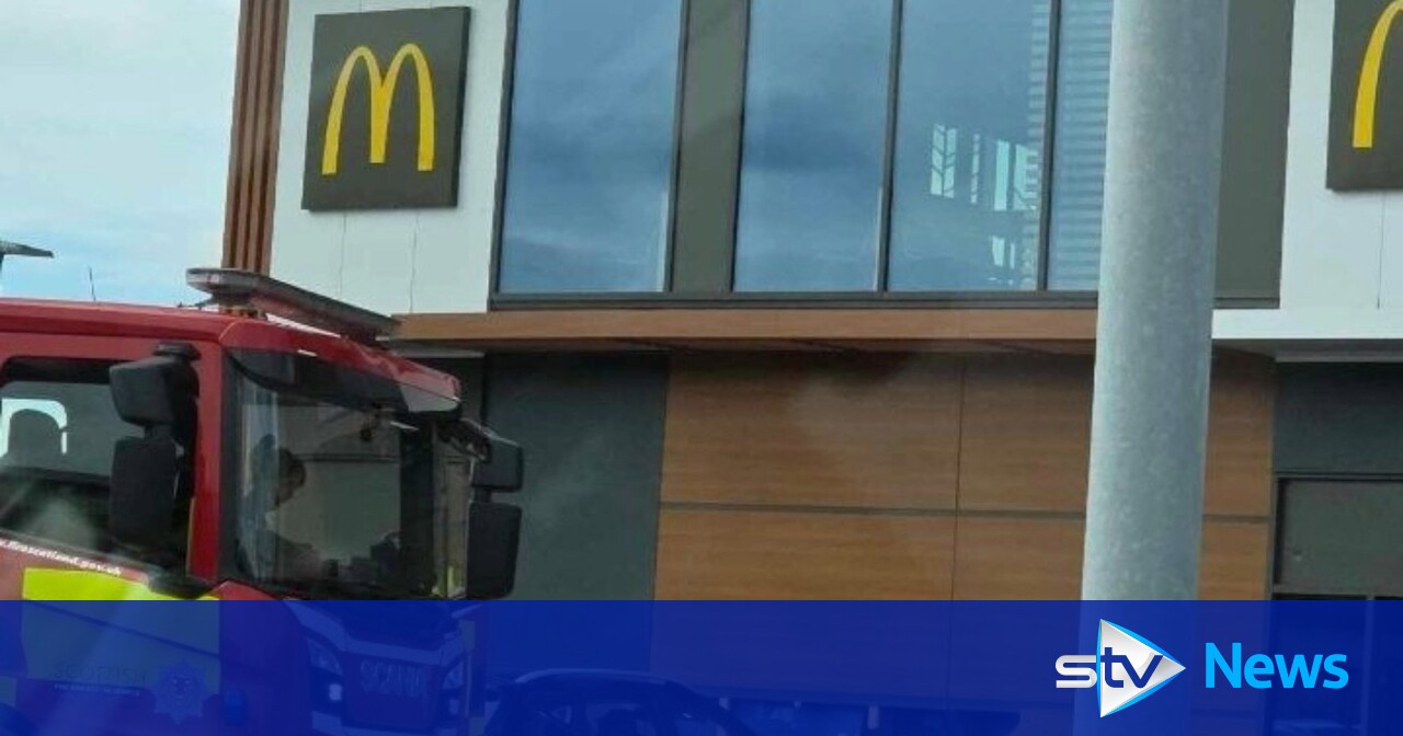 Driver taken to hospital after car crashes into McDonald's drive-thru in Glasgow | STV News