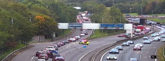 M8 and M77 closures in place after lorry crashes and sheds load of wood ...