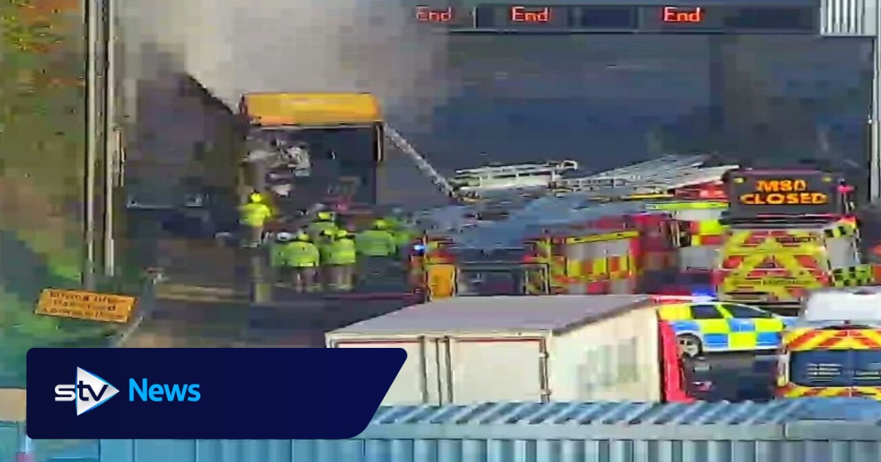 Lorry engulfed by fire on M80 causes M8 traffic jam | STV News