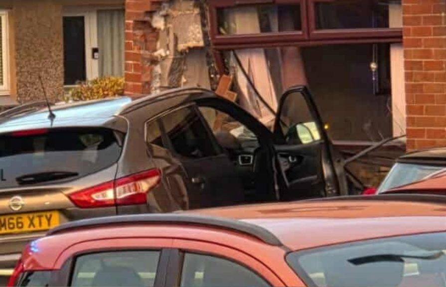 Woman, 81, and driver taken to hospital after car crashes into house ...