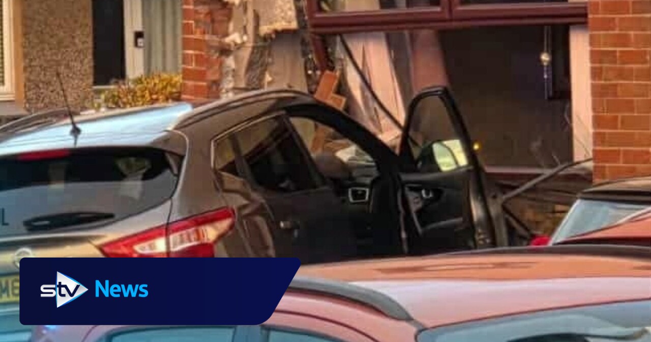 Woman, 81, and driver taken to hospital after car crashes into house ...
