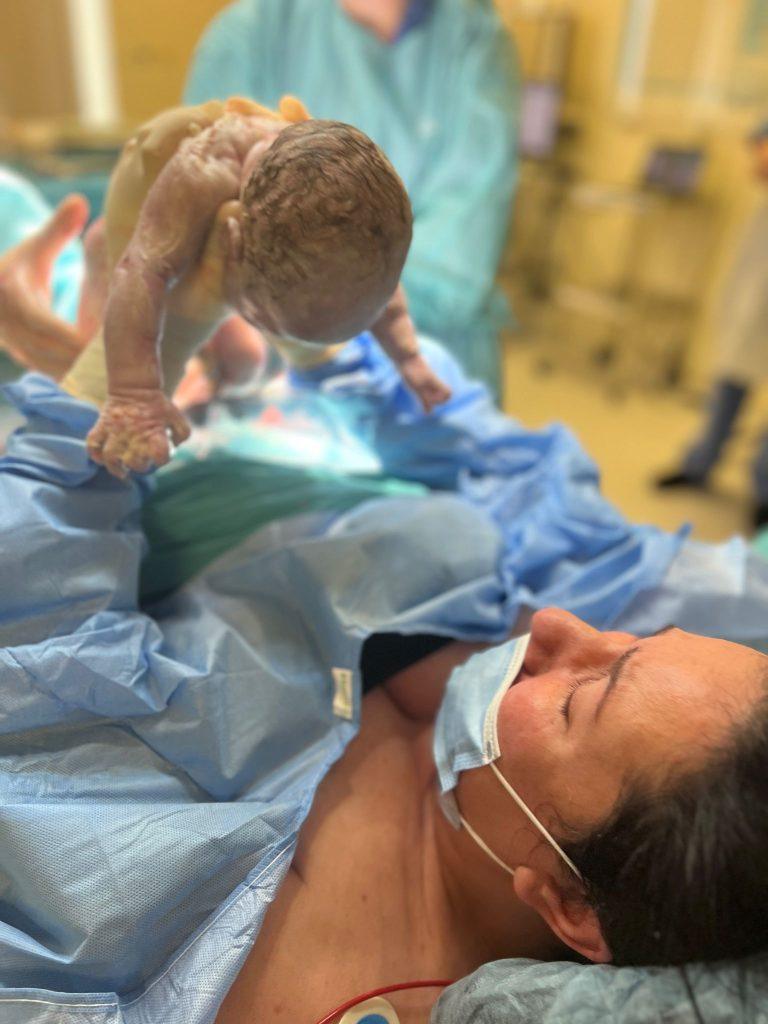 Mum lifts baby from womb during c-section in 'first of its kind' birth ...